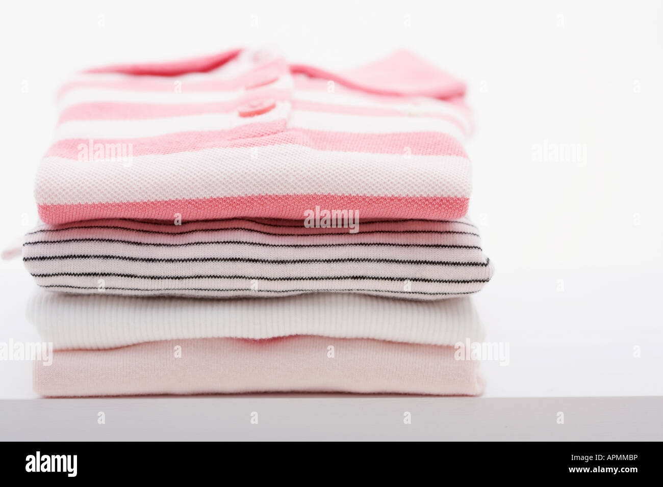Folded baby clothes Stock Photo - Alamy