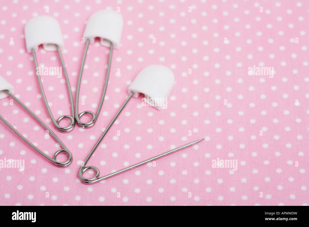 Four napkin pins Stock Photo - Alamy