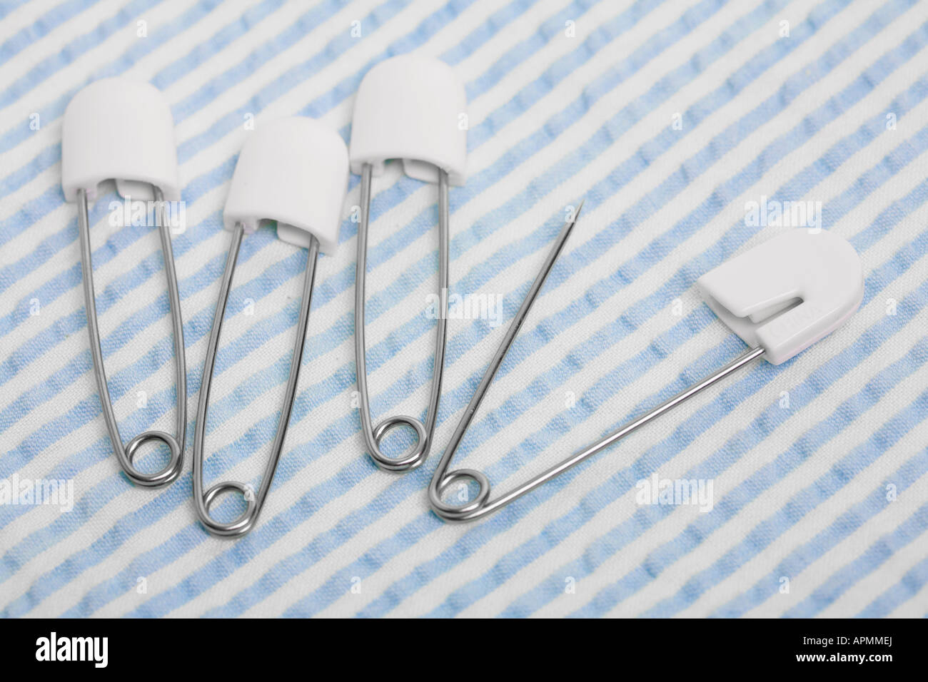 Four napkin pins Stock Photo - Alamy