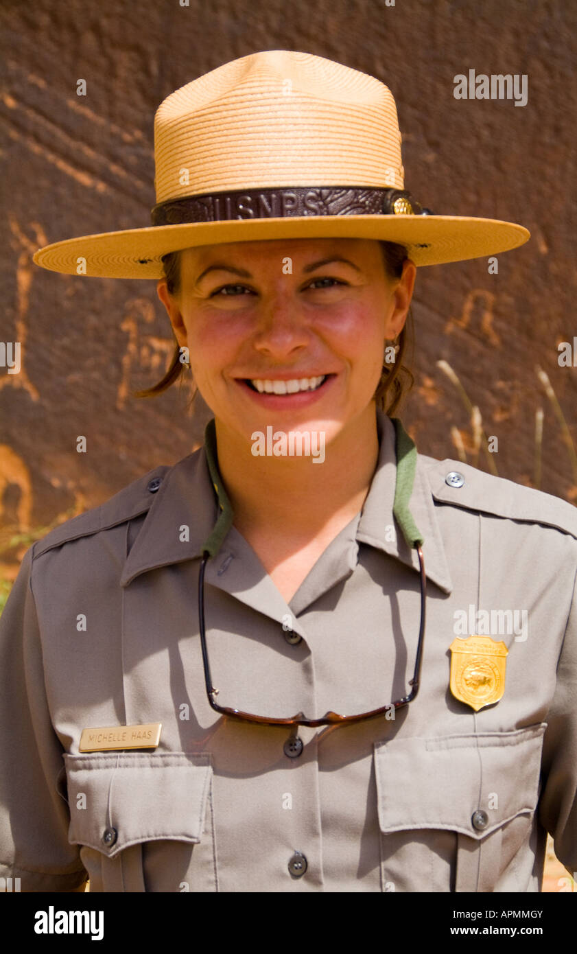Official National Park Ranger woman at the ancient Petroglyph writings ...