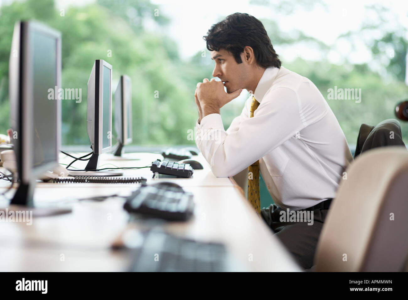 Young man using computer Stock Photo - Alamy