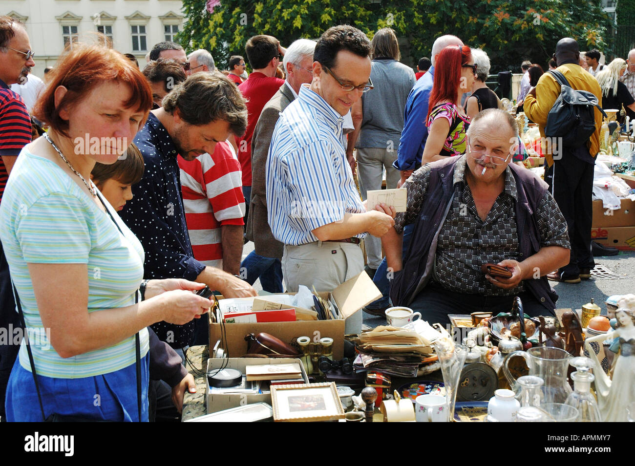 Shopping at flea market Flohmarkt at Naschmarkt Vienna Austria Stock ...