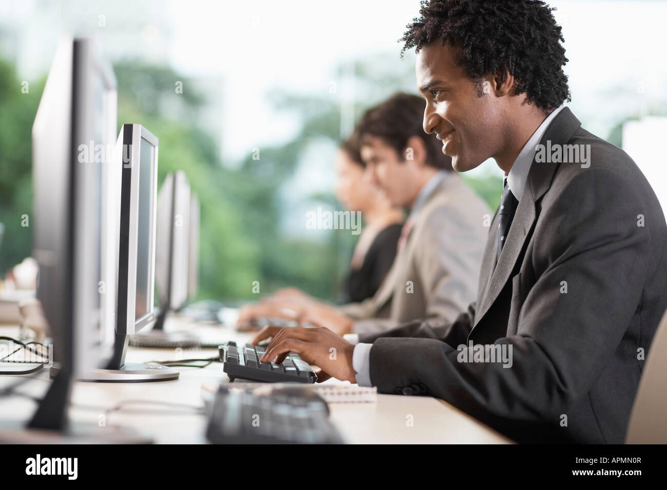 Office workers using computers Stock Photo - Alamy