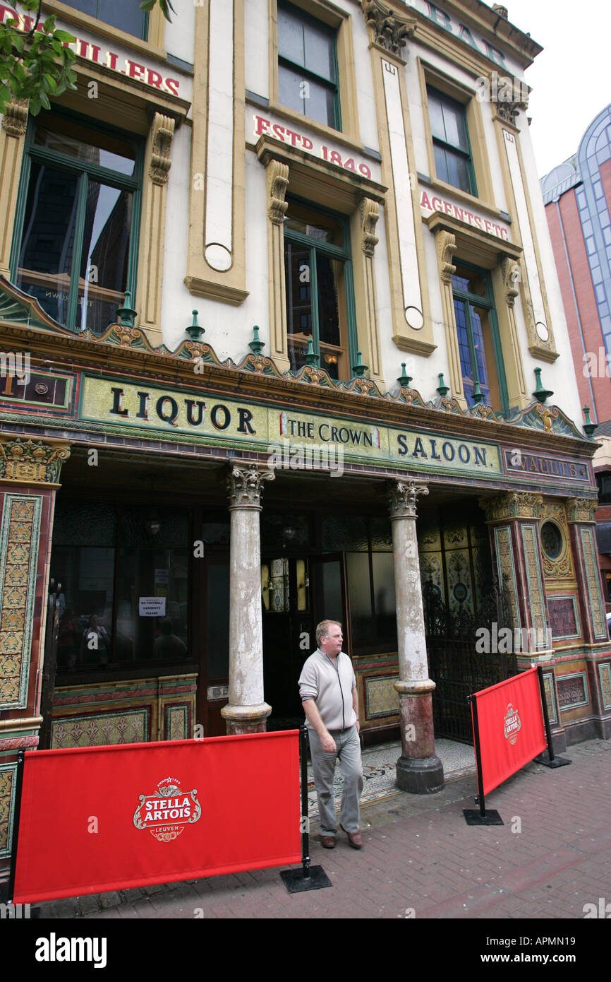 Male tourist leaves the world famous Belfast Irish pub The Crown public ...