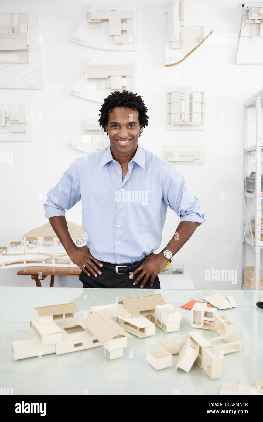 Architect with models of houses (portrait Stock Photo - Alamy