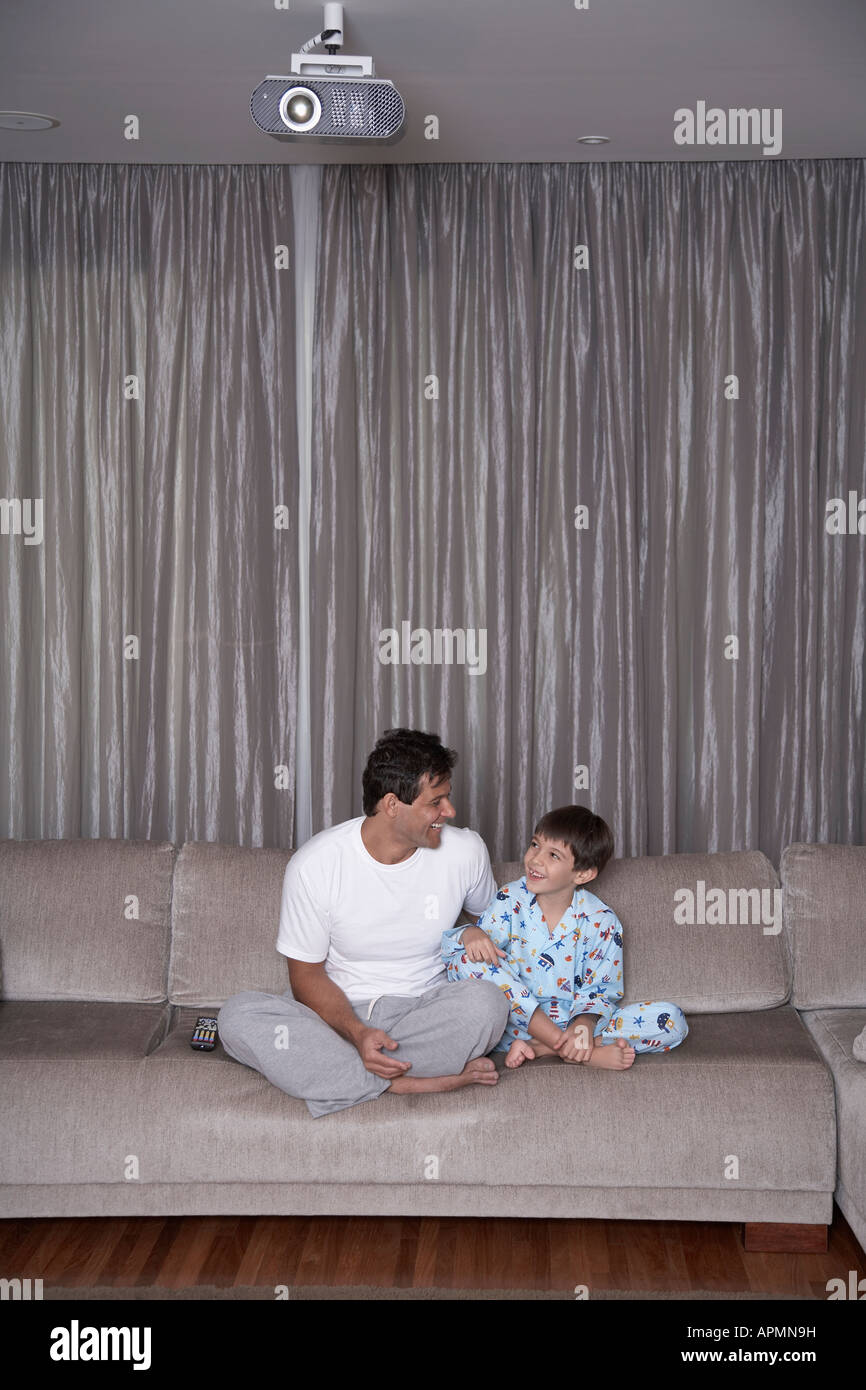 Father and son watching TV Stock Photo - Alamy