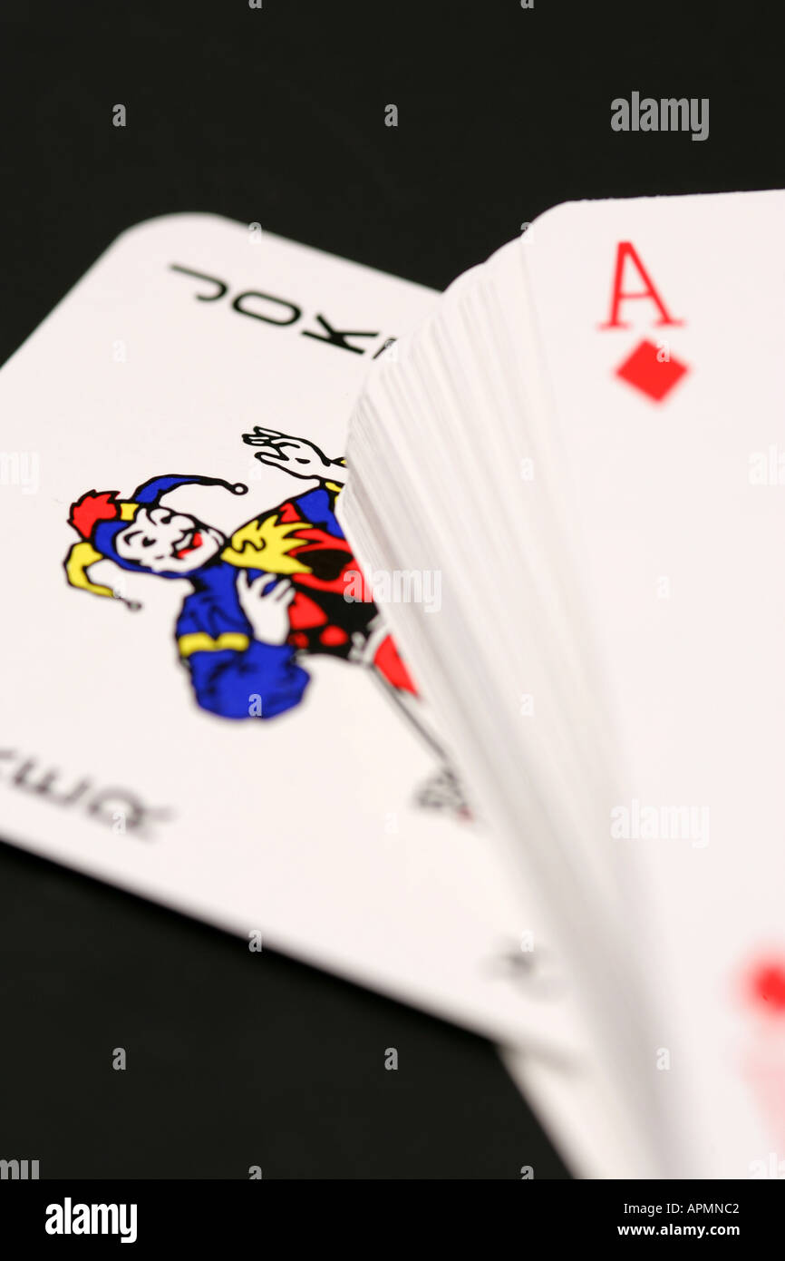 Deck of playing cards with red Ace of Hearts on top and the colourful ...