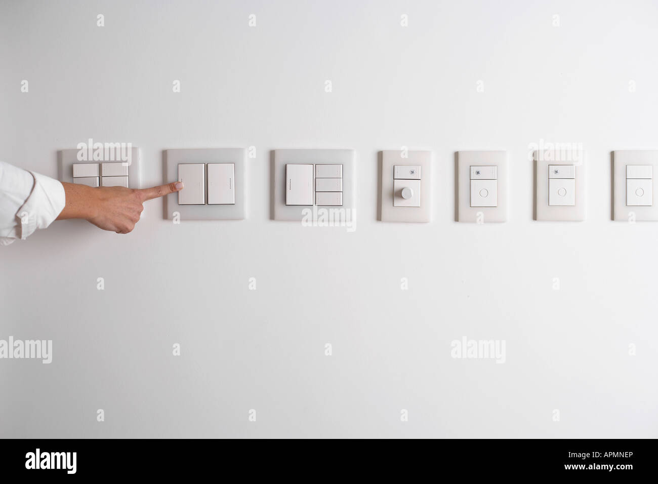 Womans hand light switch hi-res stock photography and images - Alamy