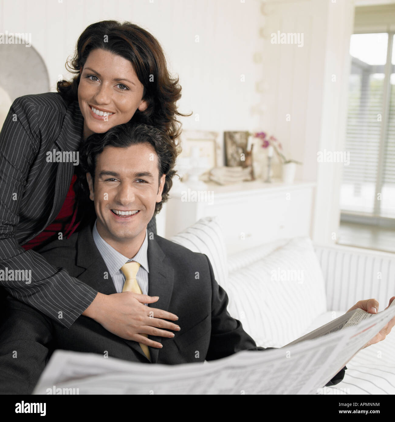 Mid adult couple reading newspaper (portrait Stock Photo - Alamy