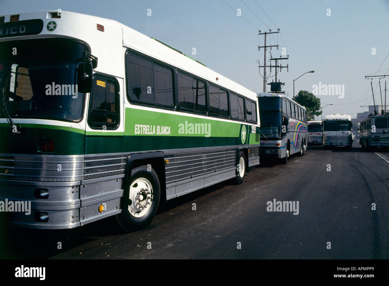 A streamlined long distance coach in the busy Terminal Central del ...