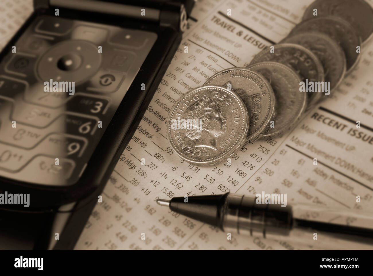 Coins on a financial paper Stock Photo - Alamy