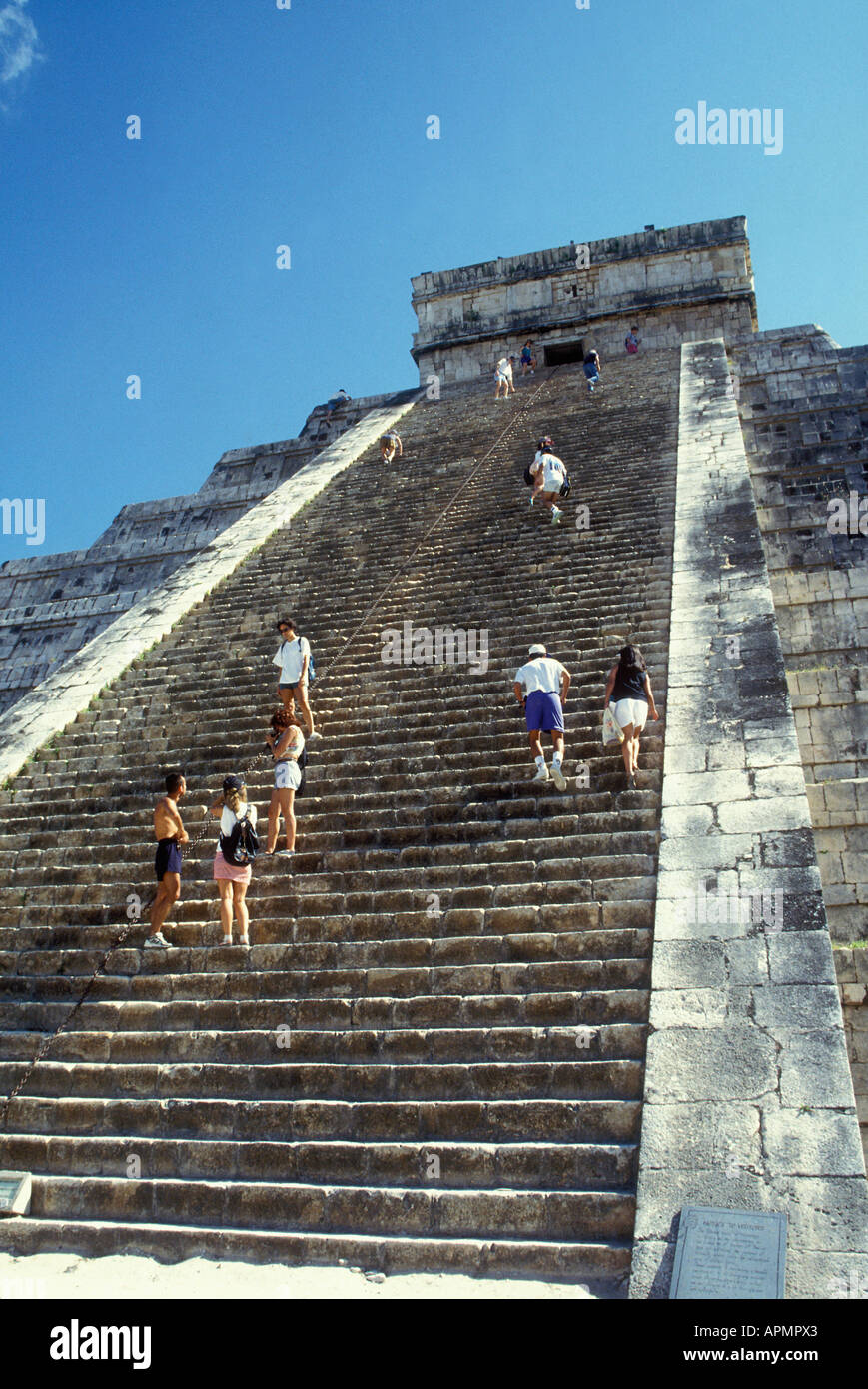 Visitors ascend the broad stone steps of the Temple of Kukulcan the ...