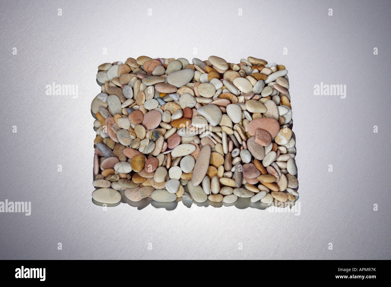 Square shape made of small sea pebbles on gray metal background Stock ...