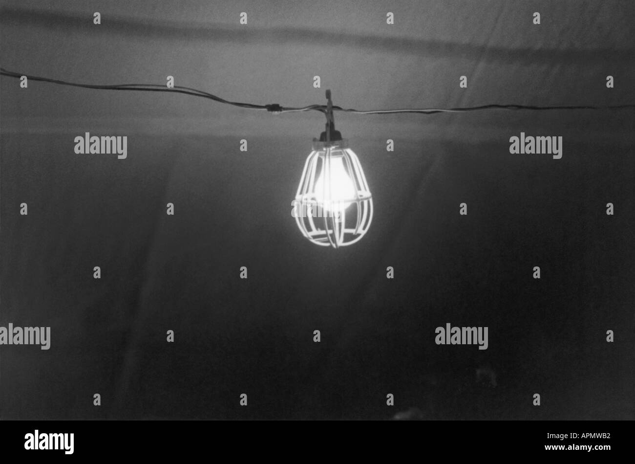 Glowing lightbulb on wire Stock Photo - Alamy