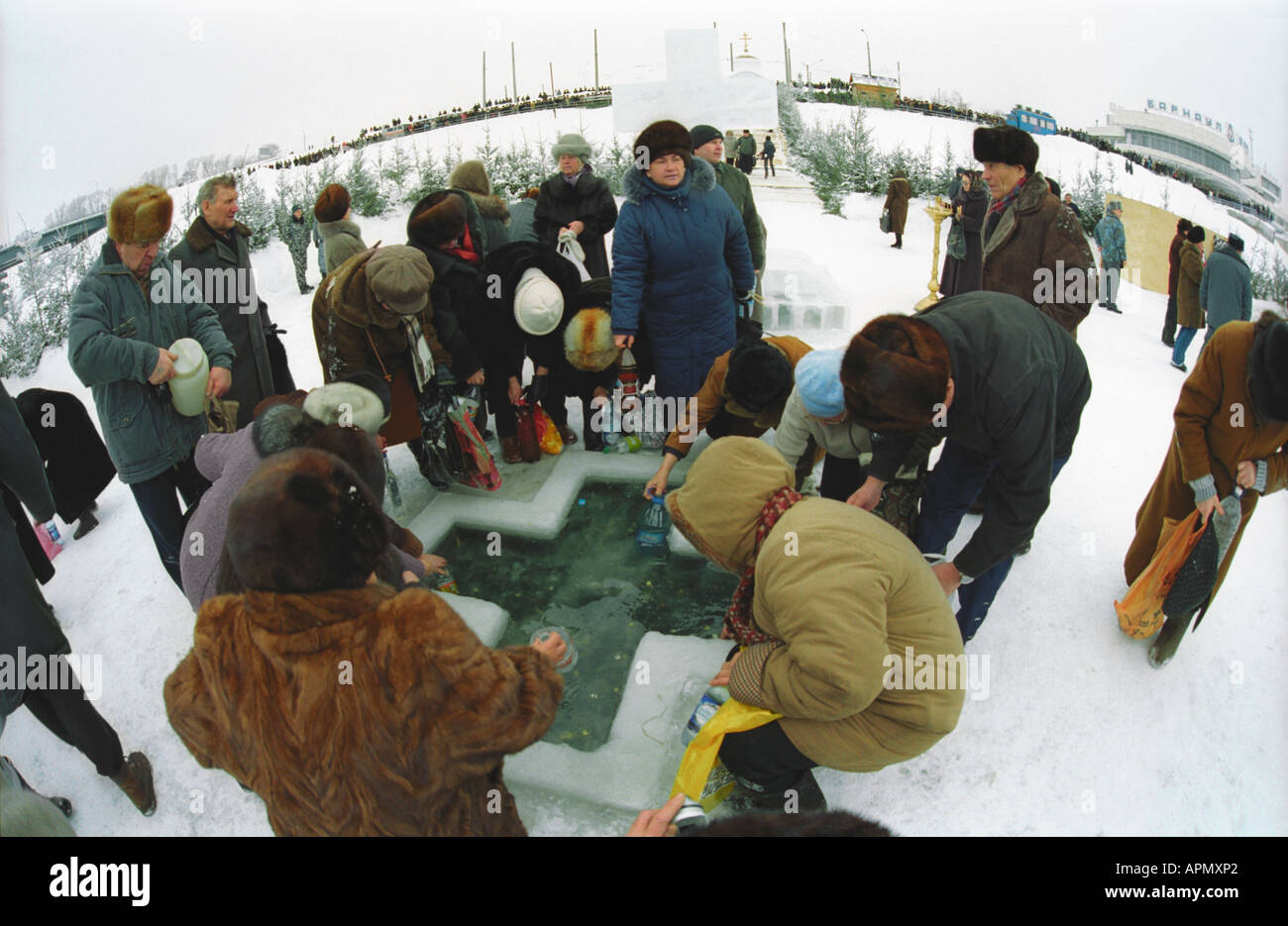 People draw sanctified water from the font. Barnaul. Epiphany Day ...