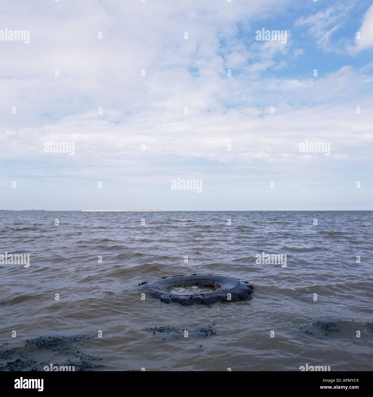 Tyre floating in the sea Stock Photo - Alamy