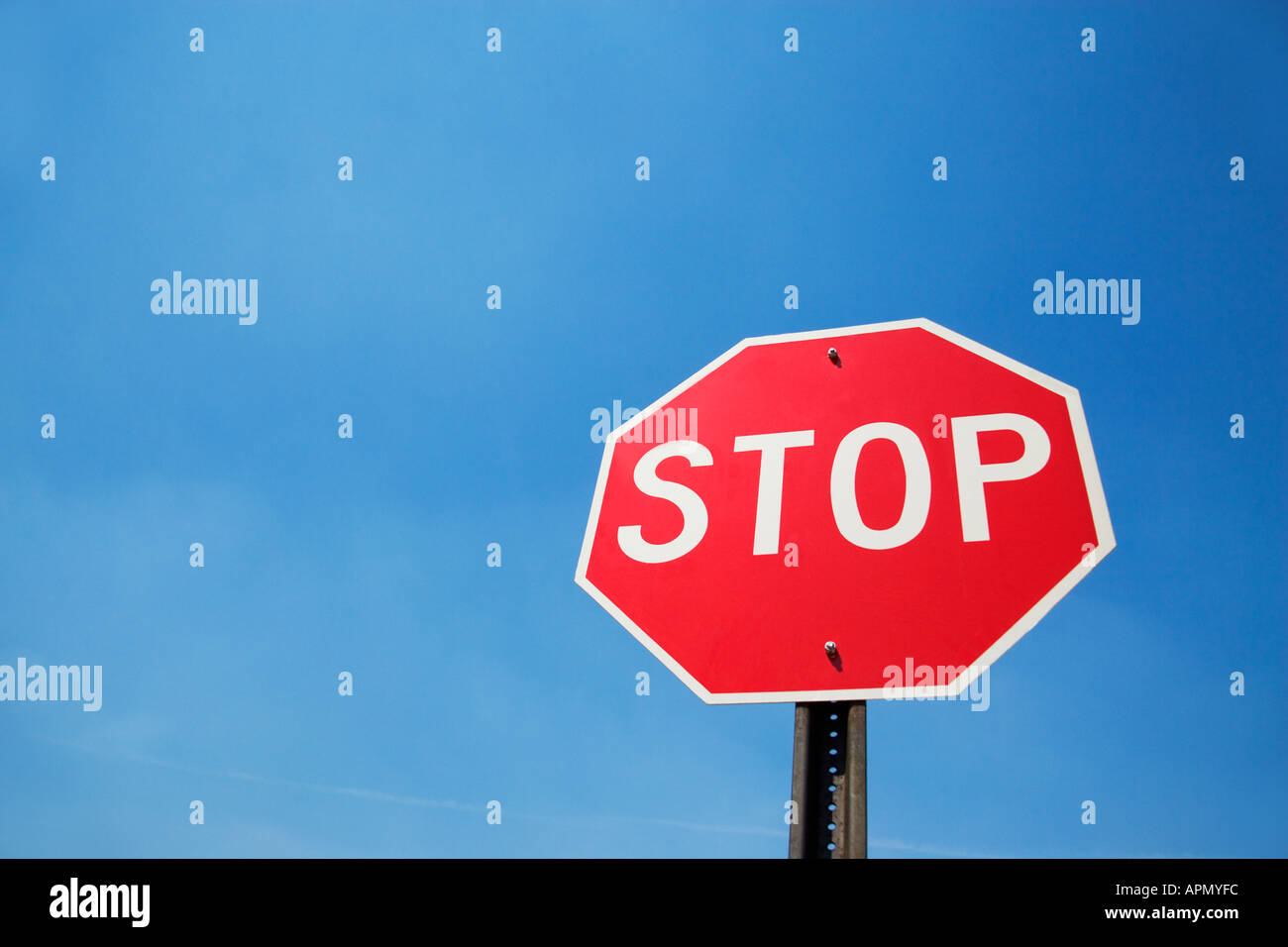 Stop sign against blue sky Stock Photo - Alamy