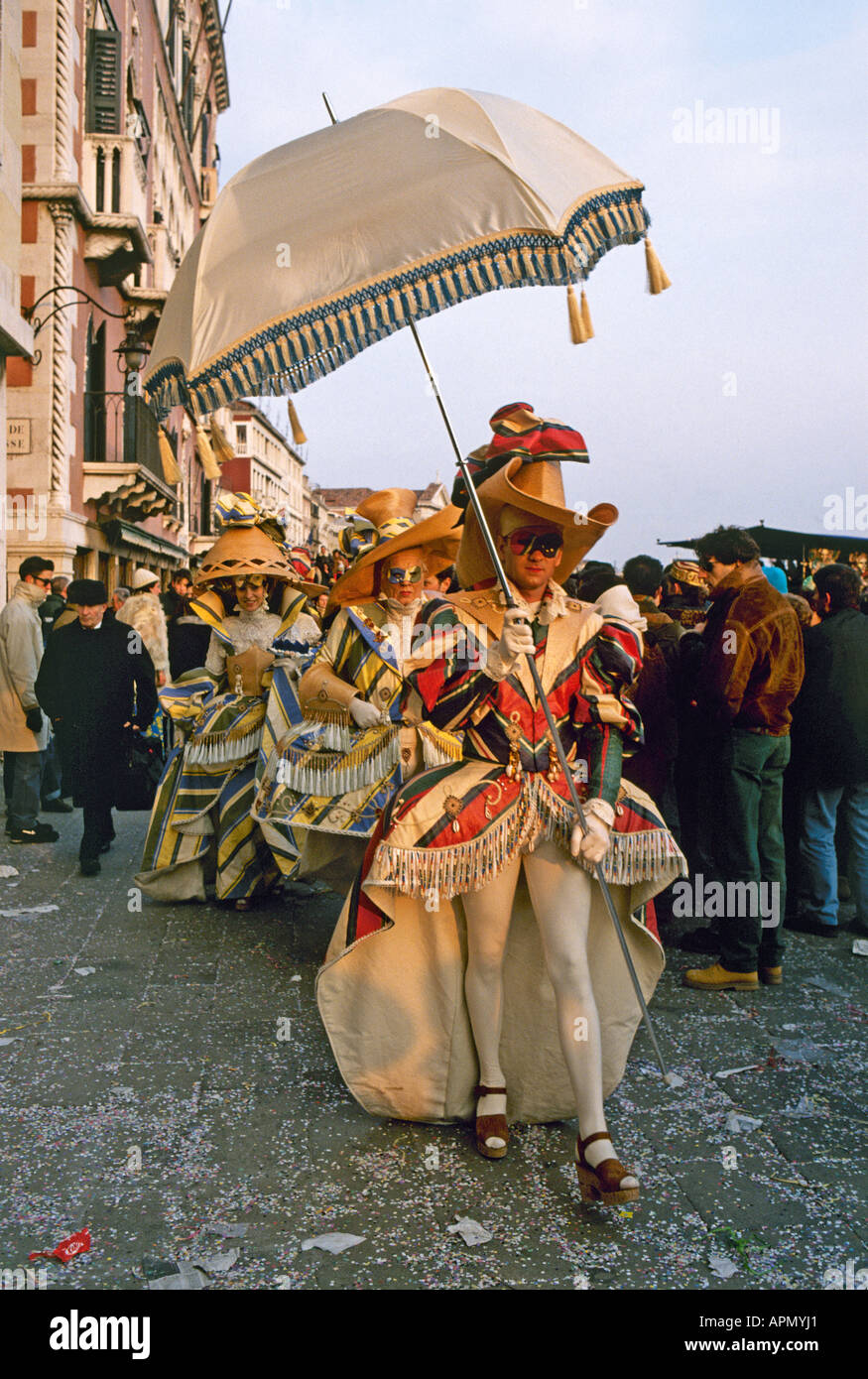A formal procession of people wearing period costumes on the occasion ...