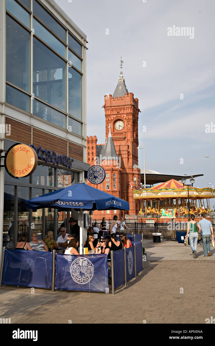 People eating at a cafe restaurant with the Pierhead Building in the ...