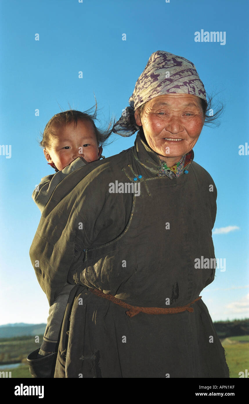 Grandmother carrying granddaughter on shoulders hi-res stock ...