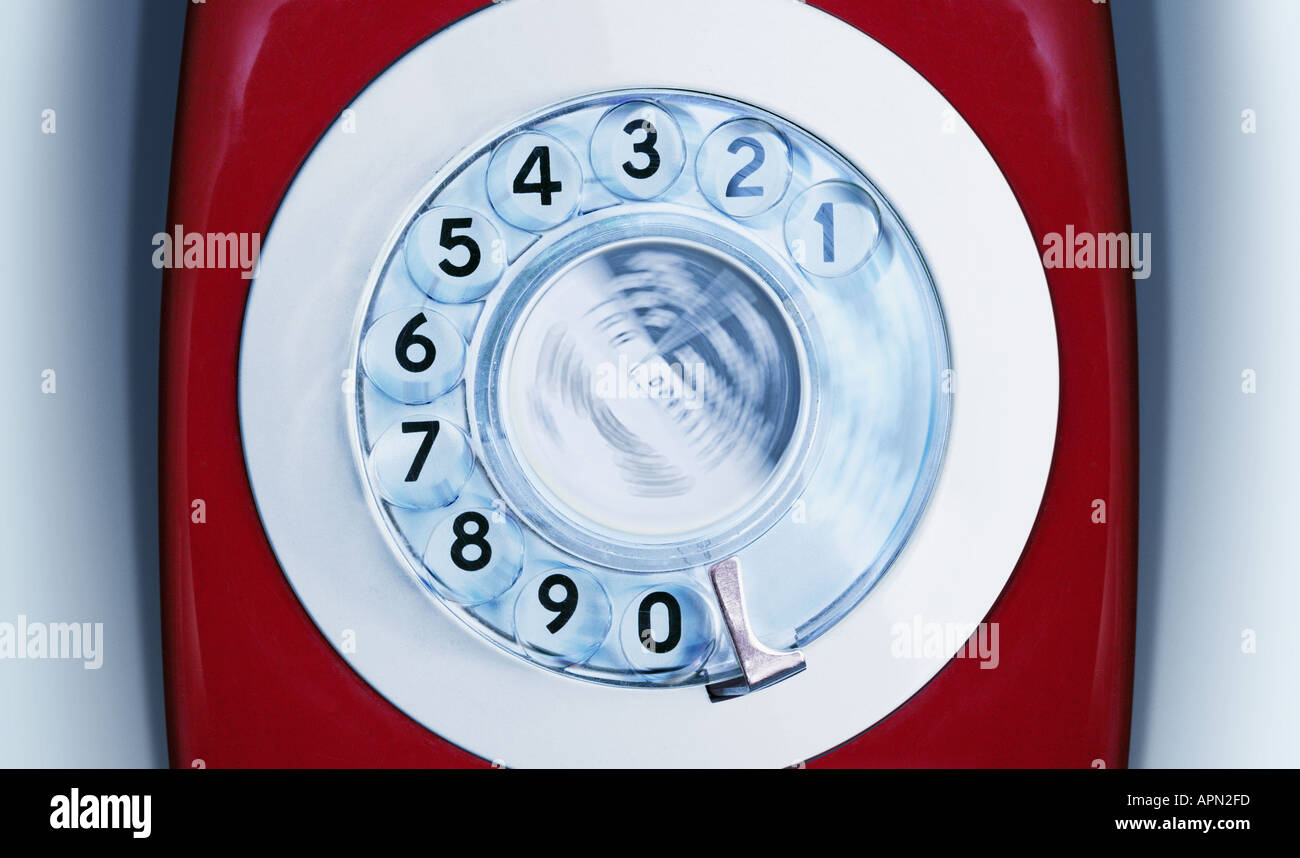 Red old phone with numbers moving Stock Photo - Alamy