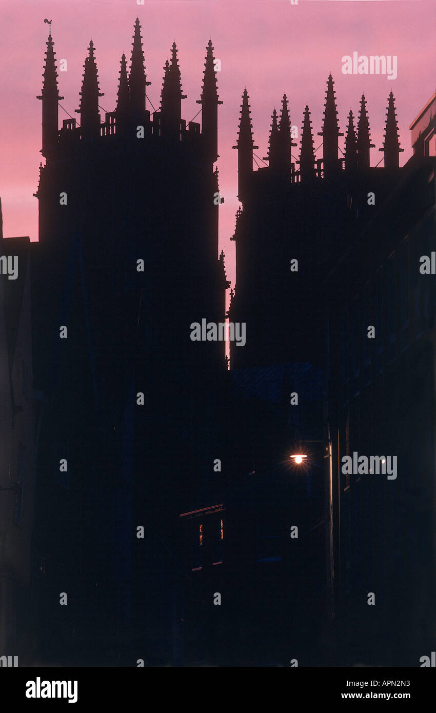 A silhouette of the medieval spires of York Minster Seen against a pink ...