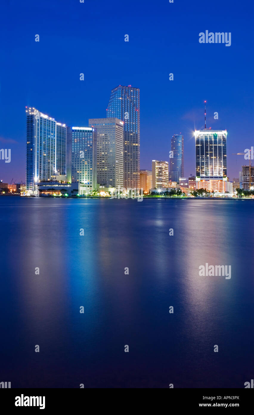 Just before a blue dawn Biscayne Bay reflects high rise buildings Miami ...