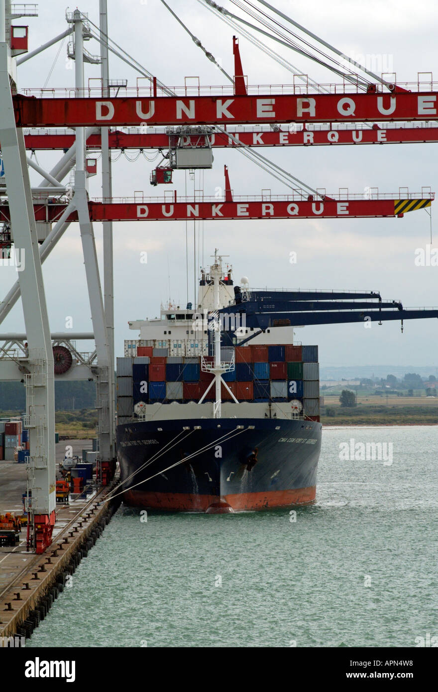 Harbour crane loads container ship with containers hi-res stock ...