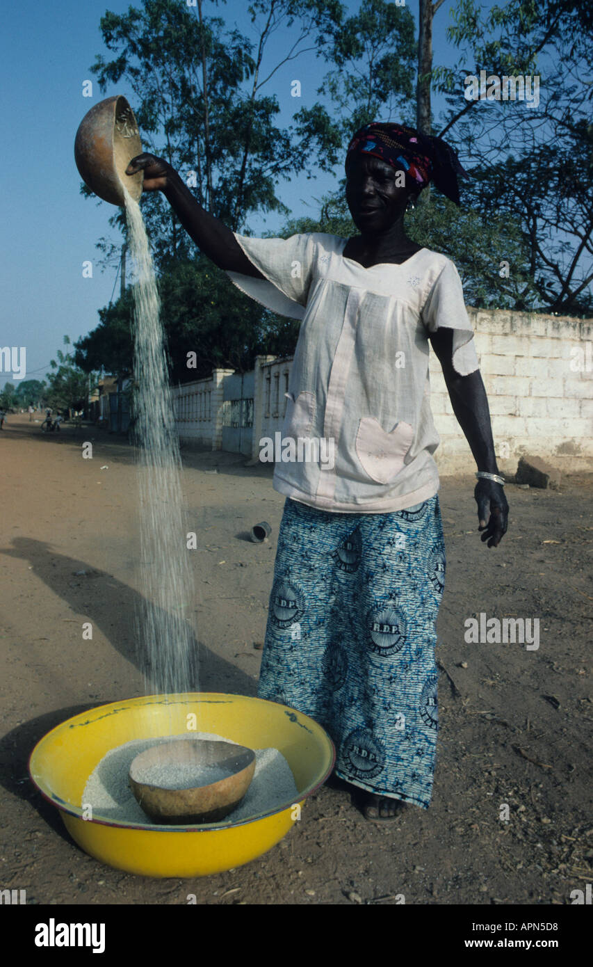 Winnowing millet in Ouagadougou the capital of Burkina Faso Stock Photo ...