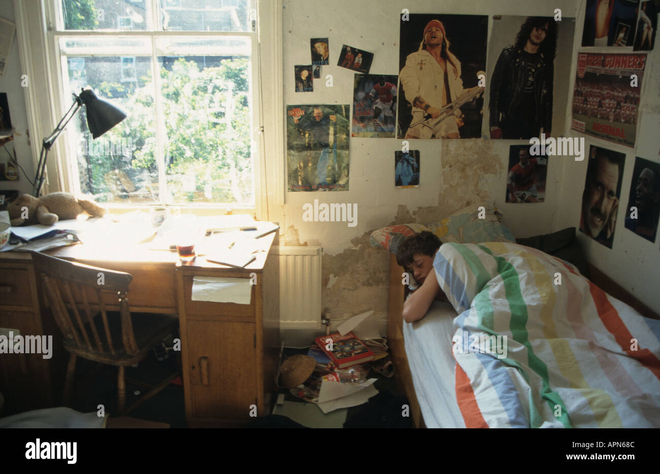 Boy sleeping in London bedroom UK Stock Photo - Alamy