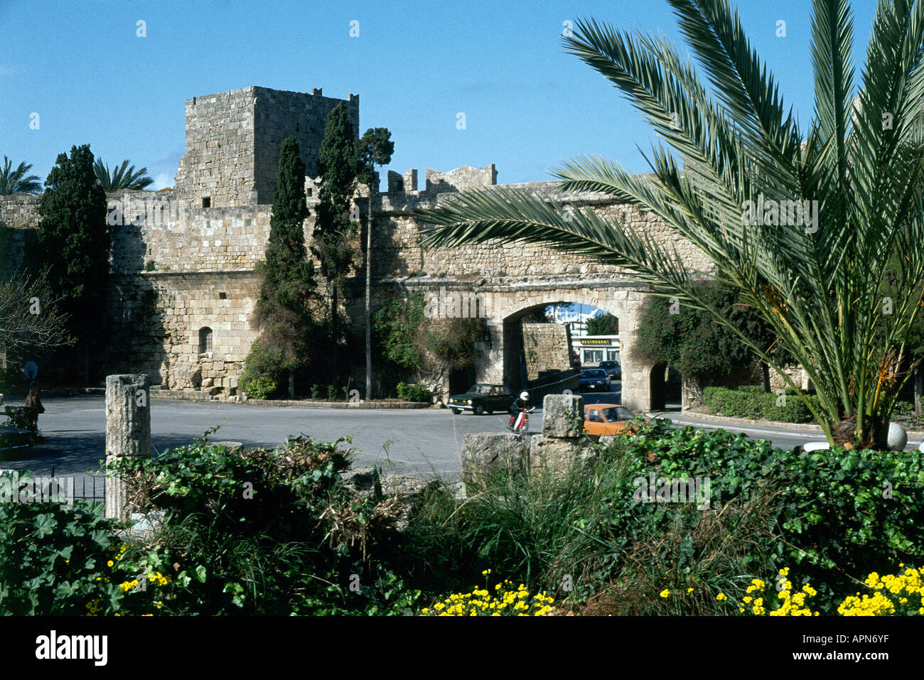 Looking across flowering shrubs towards the Liberty Gate built in 1512 ...
