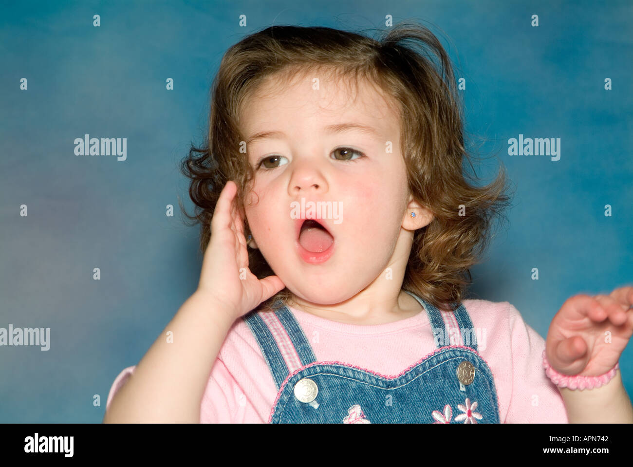 Young girl shouting to alert someone or communicate some thought Stock ...