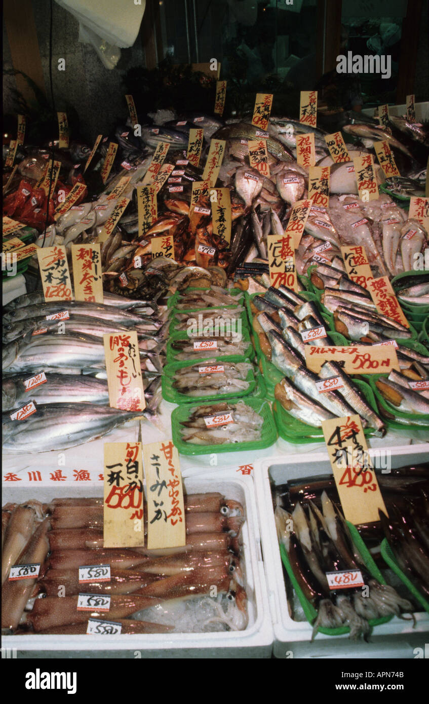 Fish and squid on display in Tsukiji Fish Market Tokyo Japan Stock ...