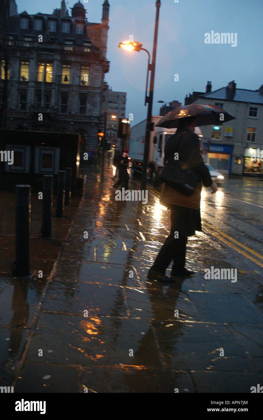 Early Morning city commute in the rain Stock Photo - Alamy