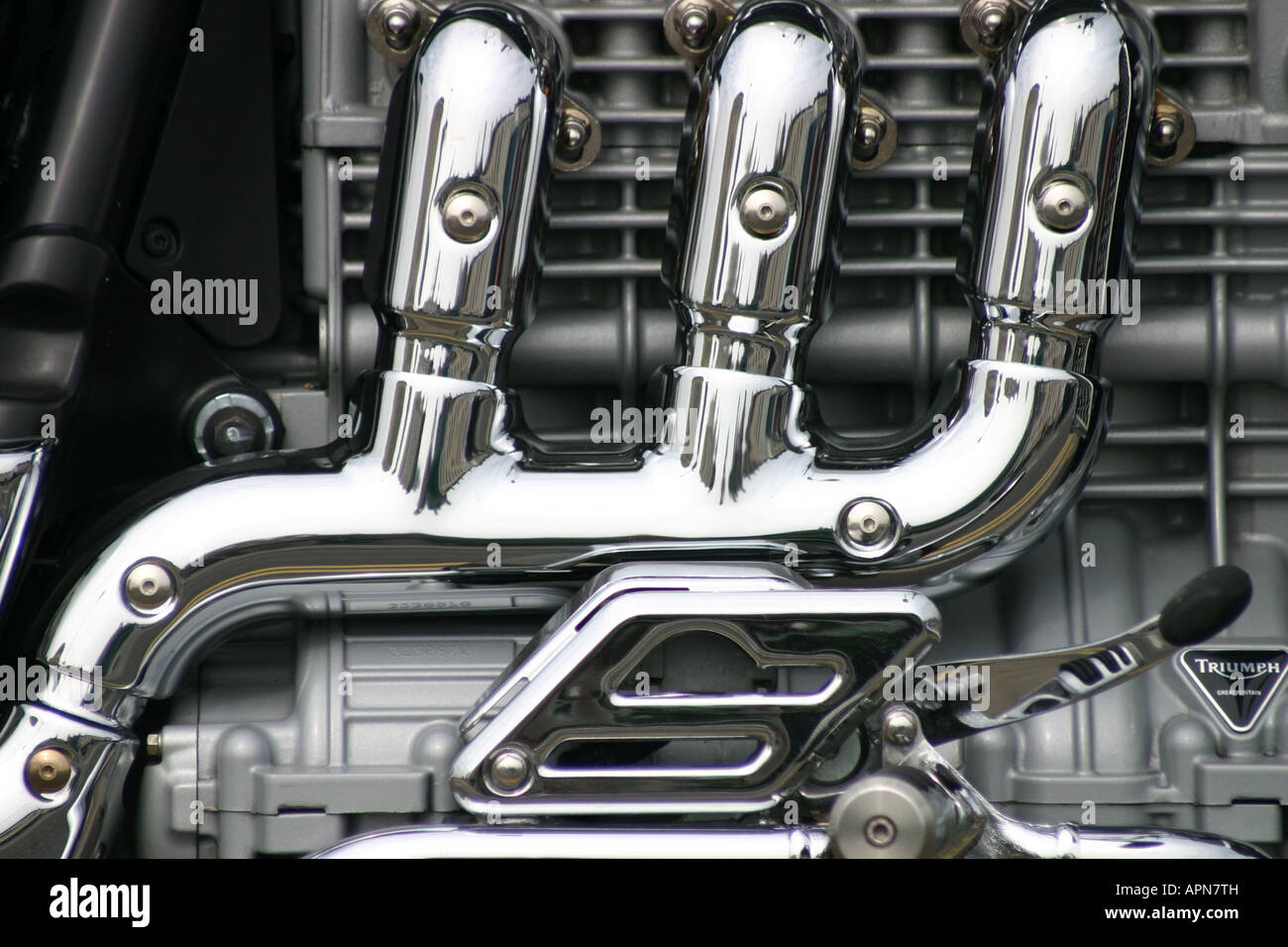 shiny classic chrome motor cycle exhaust manifold Stock Photo - Alamy