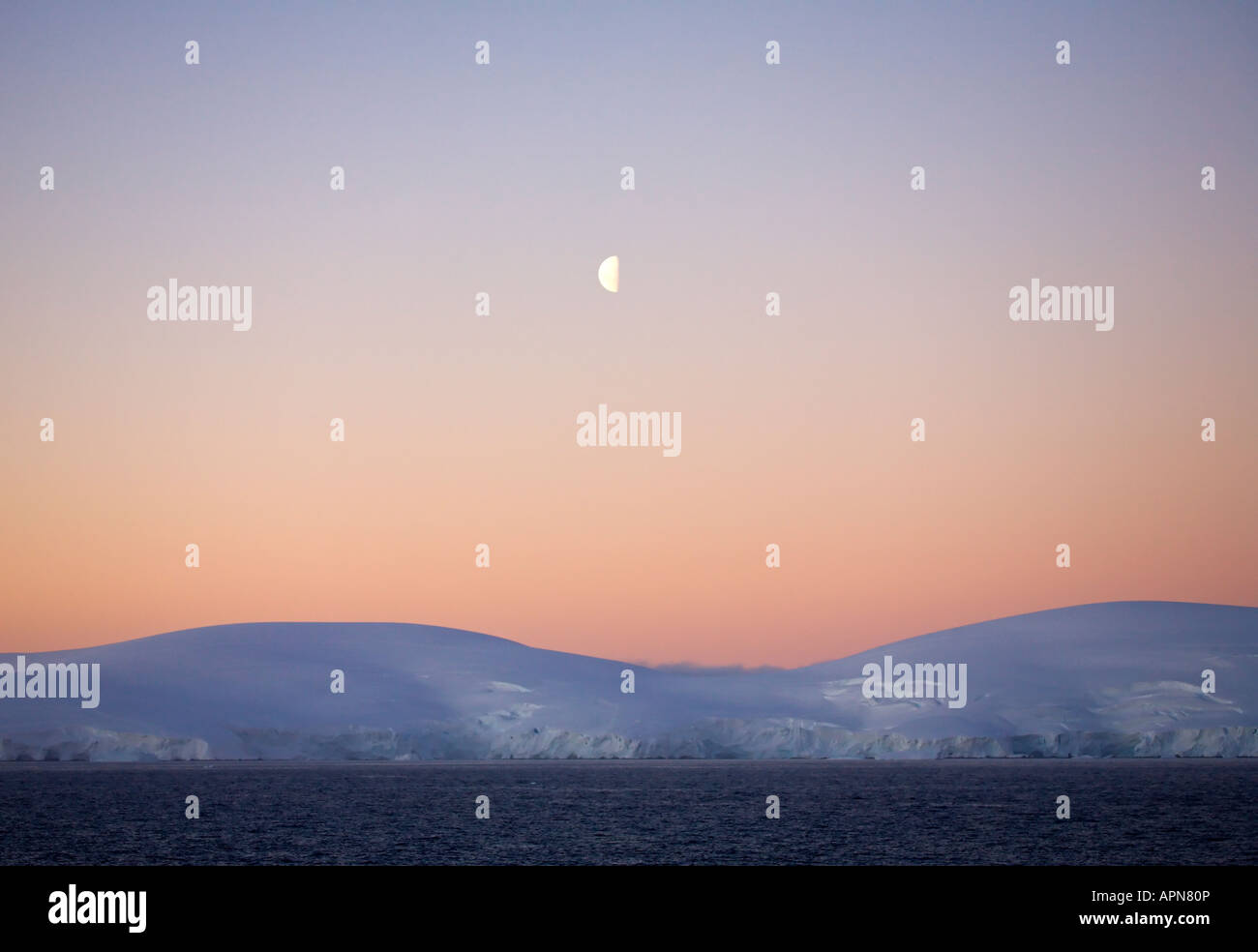 Midnight moon over Antarctica Stock Photo - Alamy