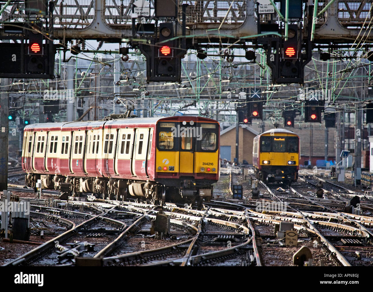Two STP commuter trains outside Glasgow Central railway station passing ...
