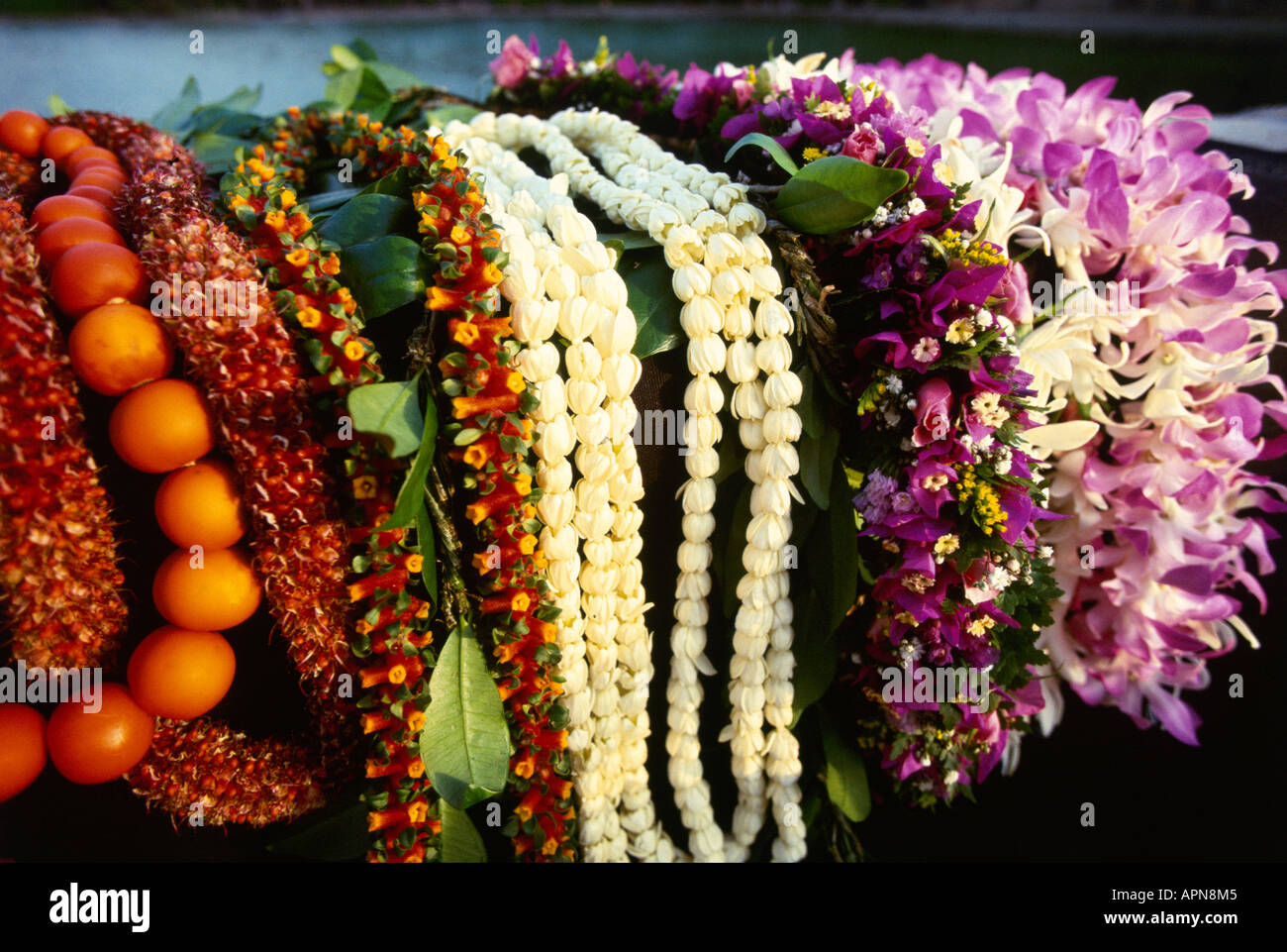 A selection of different leis fashioned from a variety of flowers ...