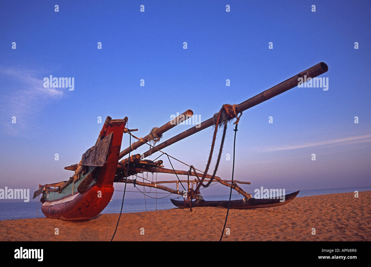 SRI LANKA A traditional wooden oruwa fishing boat on the beach at ...