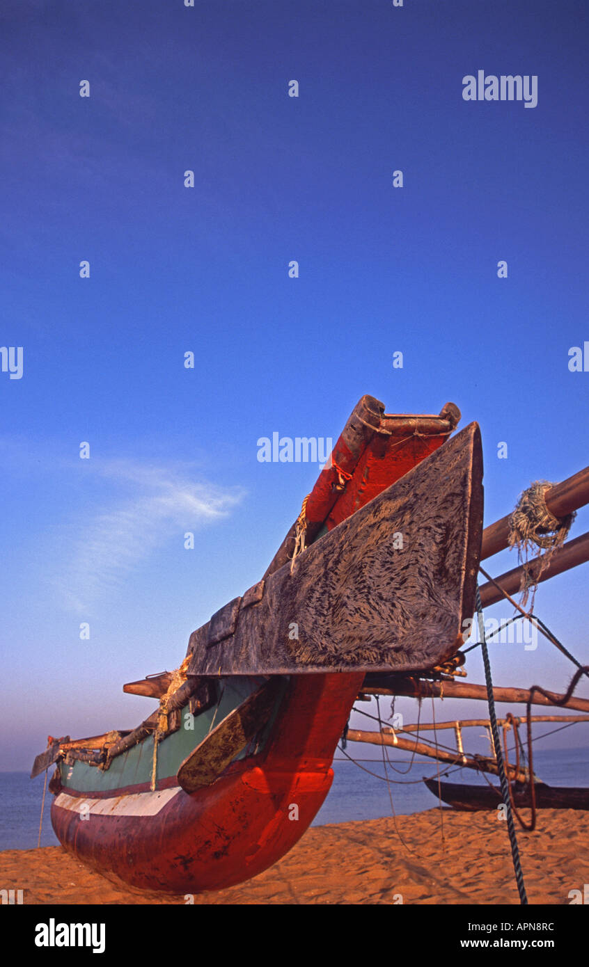SRI LANKA A traditional wooden oruwa fishing boat on the beach at ...