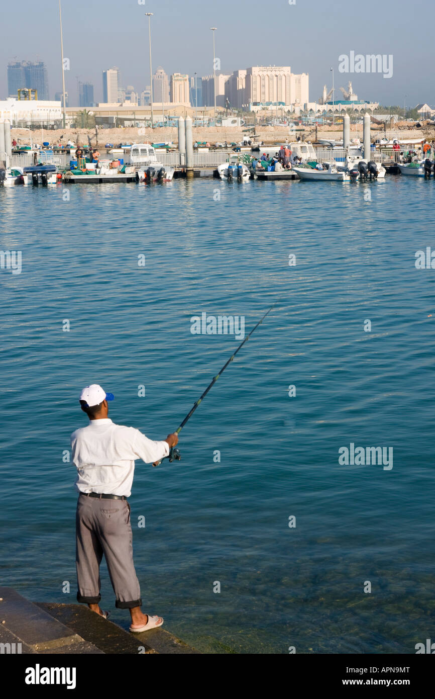 Middle east Qatar Doha harbour fisherman Stock Photo - Alamy