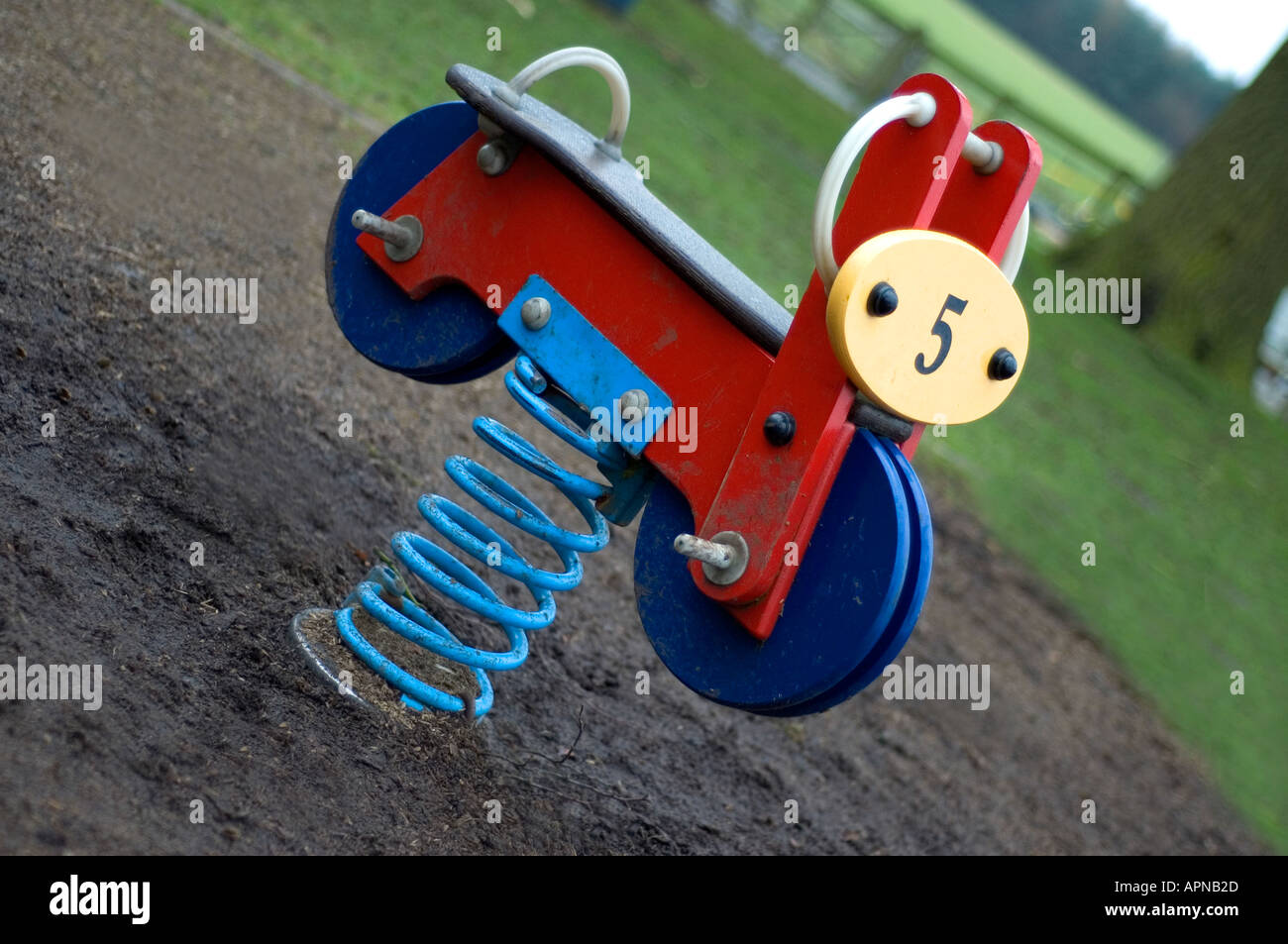 Childrens rocker in deserted playground Stock Photo - Alamy