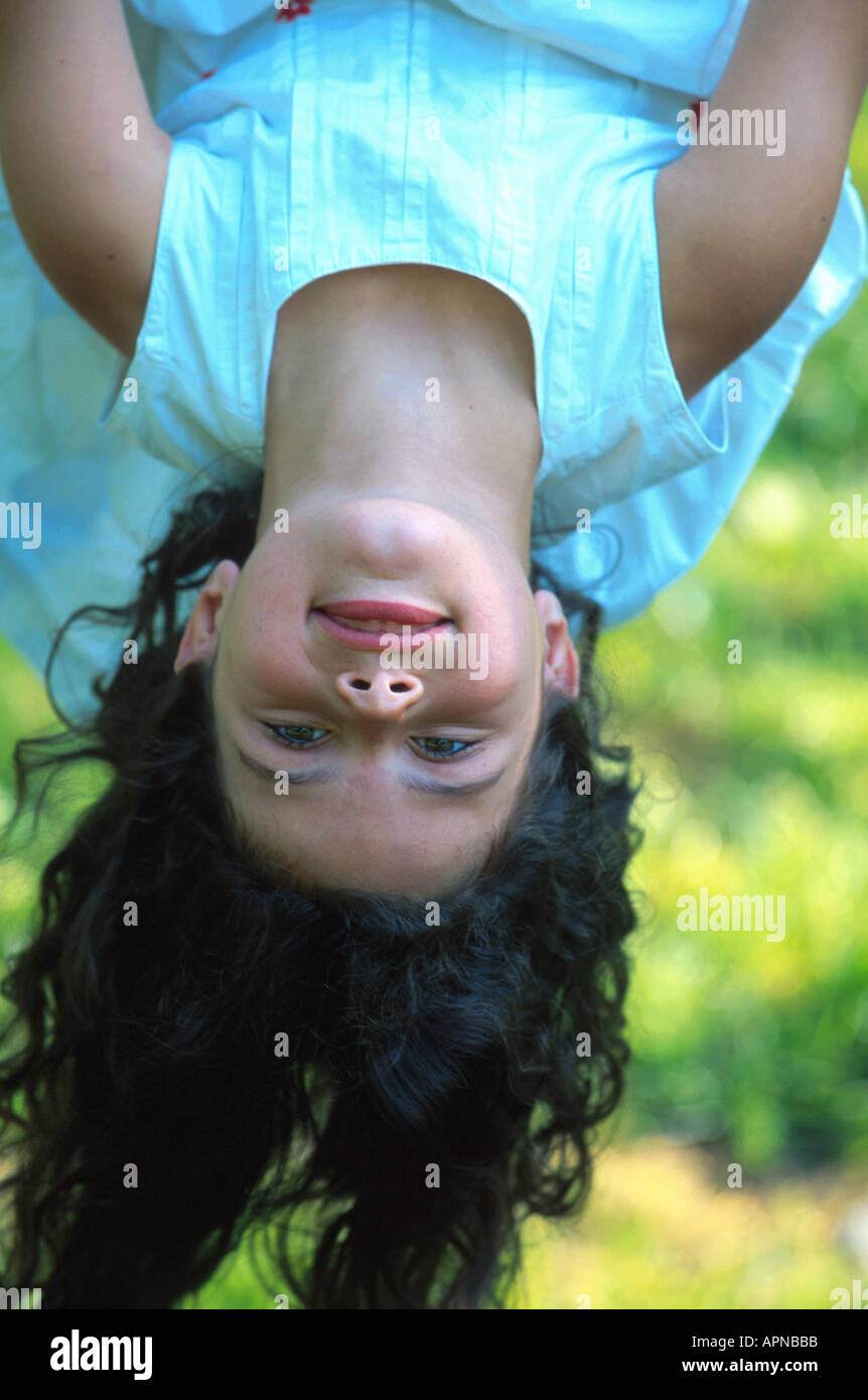 girl hanging upside down Stock Photo - Alamy