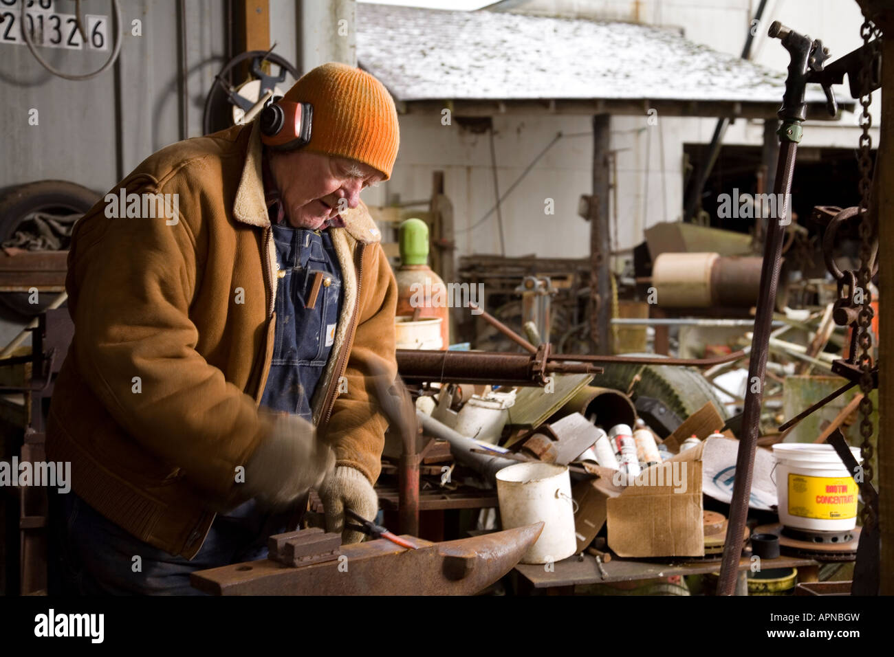 senior male blacksmithing in outdoor farm shop Stock Photo - Alamy