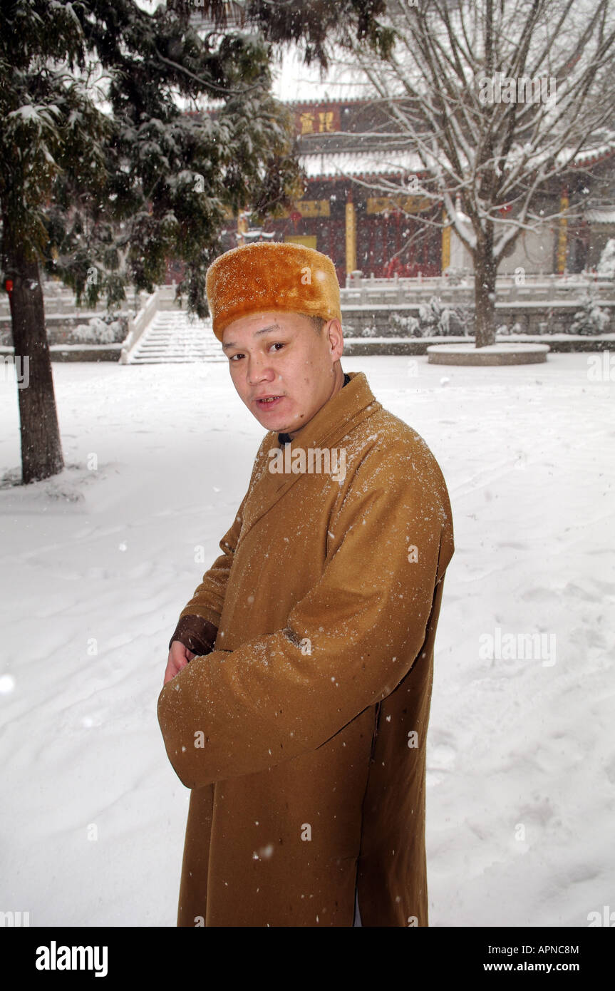 A Chinese Buddhist monk on his way to his room in Qi Xia monestary near ...