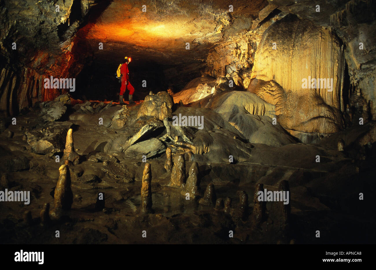 cave, Fontaine de Champclos, caver and dropstone formation, France ...