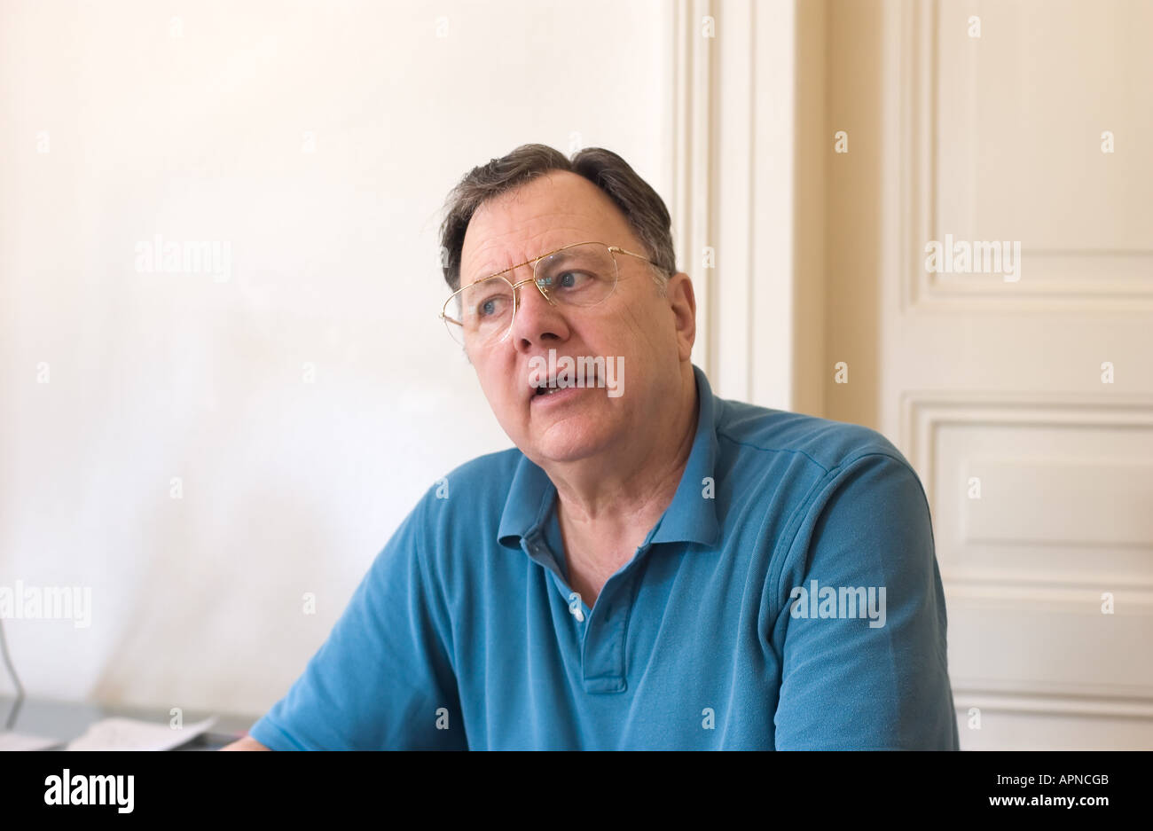 MR MATURE MAN'S PORTRAIT WITH BLUE POLO SHIRT Stock Photo - Alamy