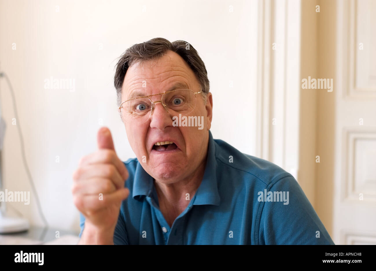 MR MATURE MAN'S PORTRAIT WITH BLUE POLO SHIRT Stock Photo - Alamy