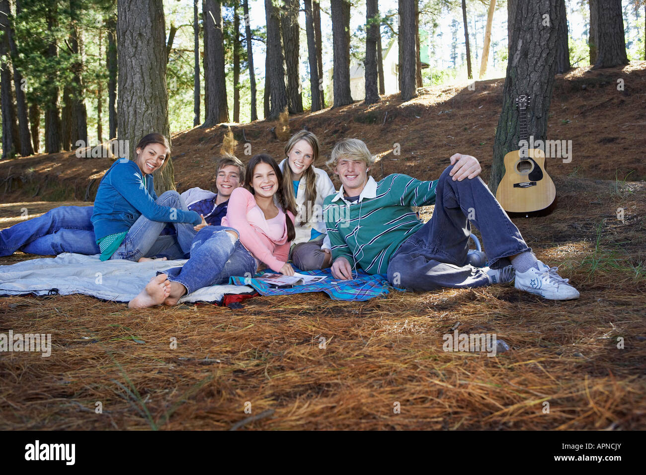 Group portrait of teenagers in forest Stock Photo - Alamy