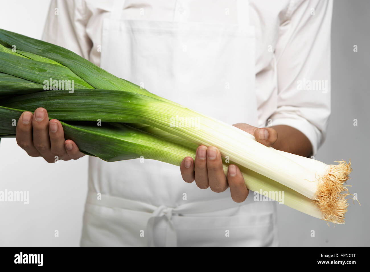 Man holding leek hi-res stock photography and images - Alamy